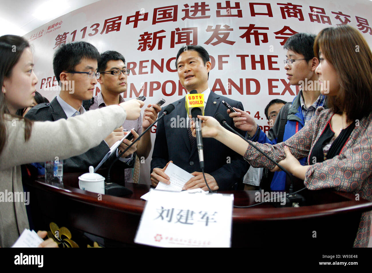 Liu Jianjun, center, the fairs spokesman is interviewed during the ...