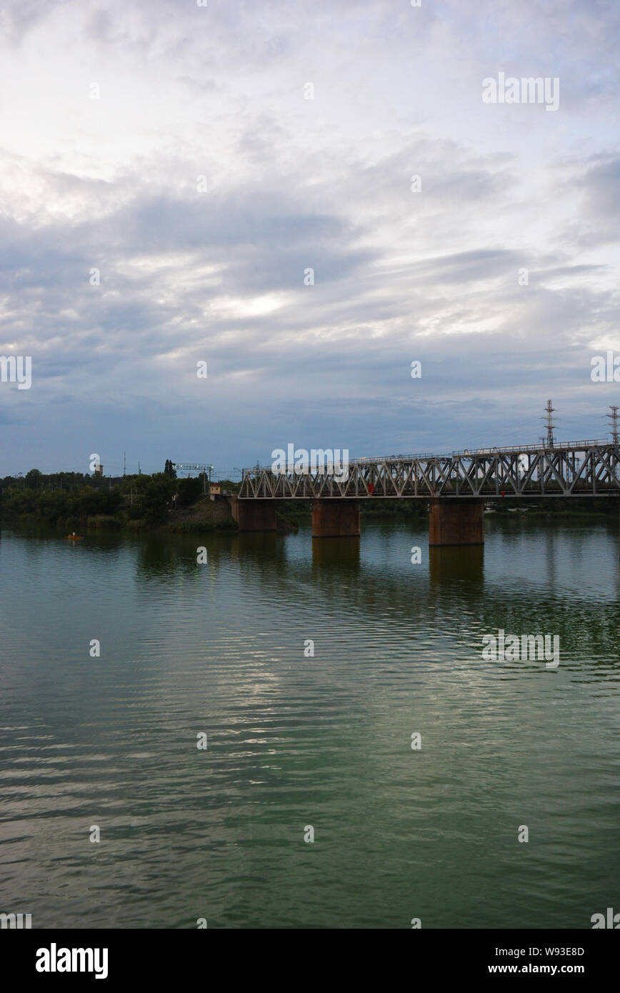 The gray Samara railway bridge over the surface of the Samara river ...