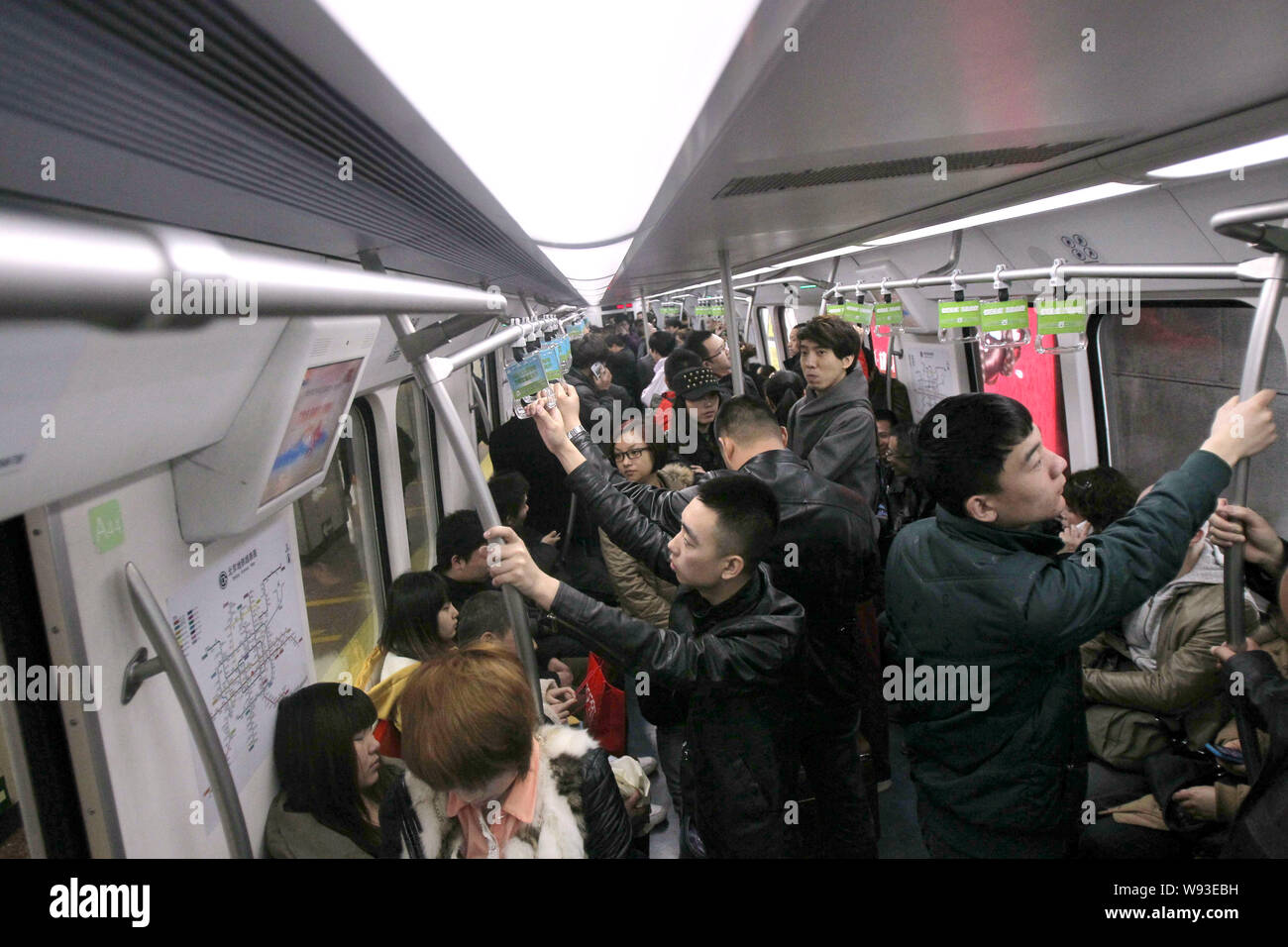 --FILE--Passengers take a train of Metro Line 1 in Beijing, China, 15 ...