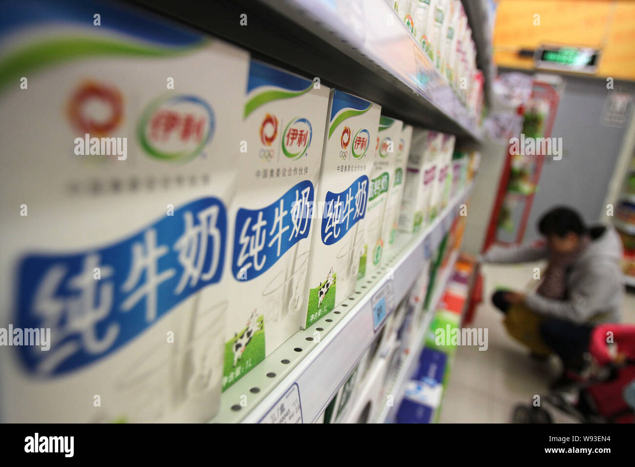 --FILE--Cartons of Yili pure milk are displayed for sale at a ...