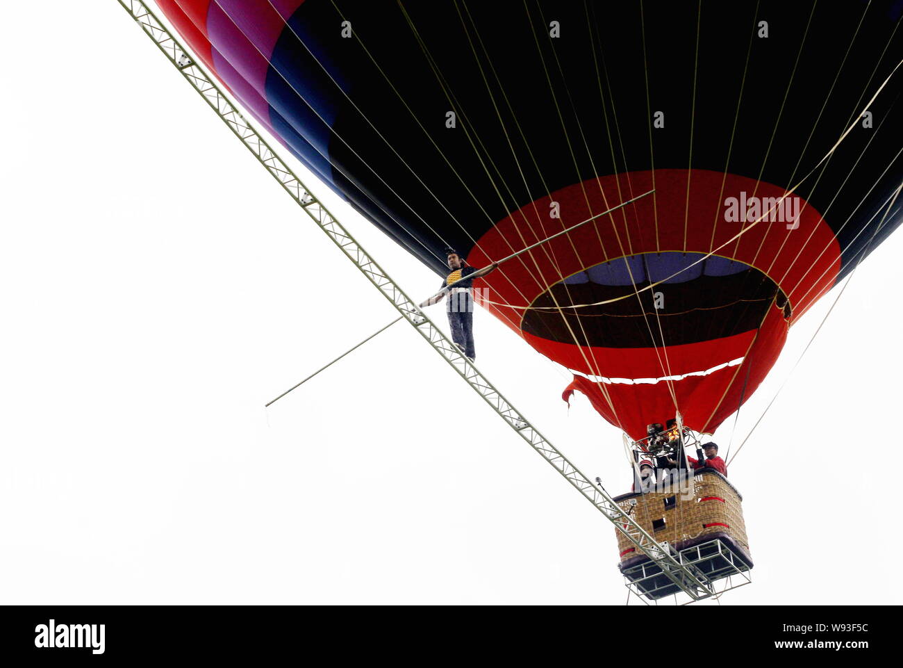 Chinese Uighur tightrope walker Aisikaier Wubulikaisimu walks on a ...