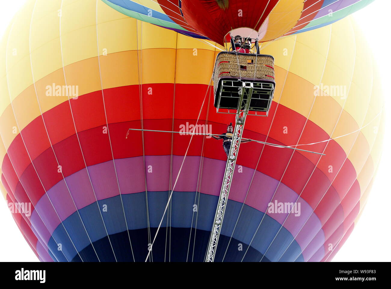 Chinese Uighur tightrope walker Aisikaier Wubulikaisimu walks on a ...