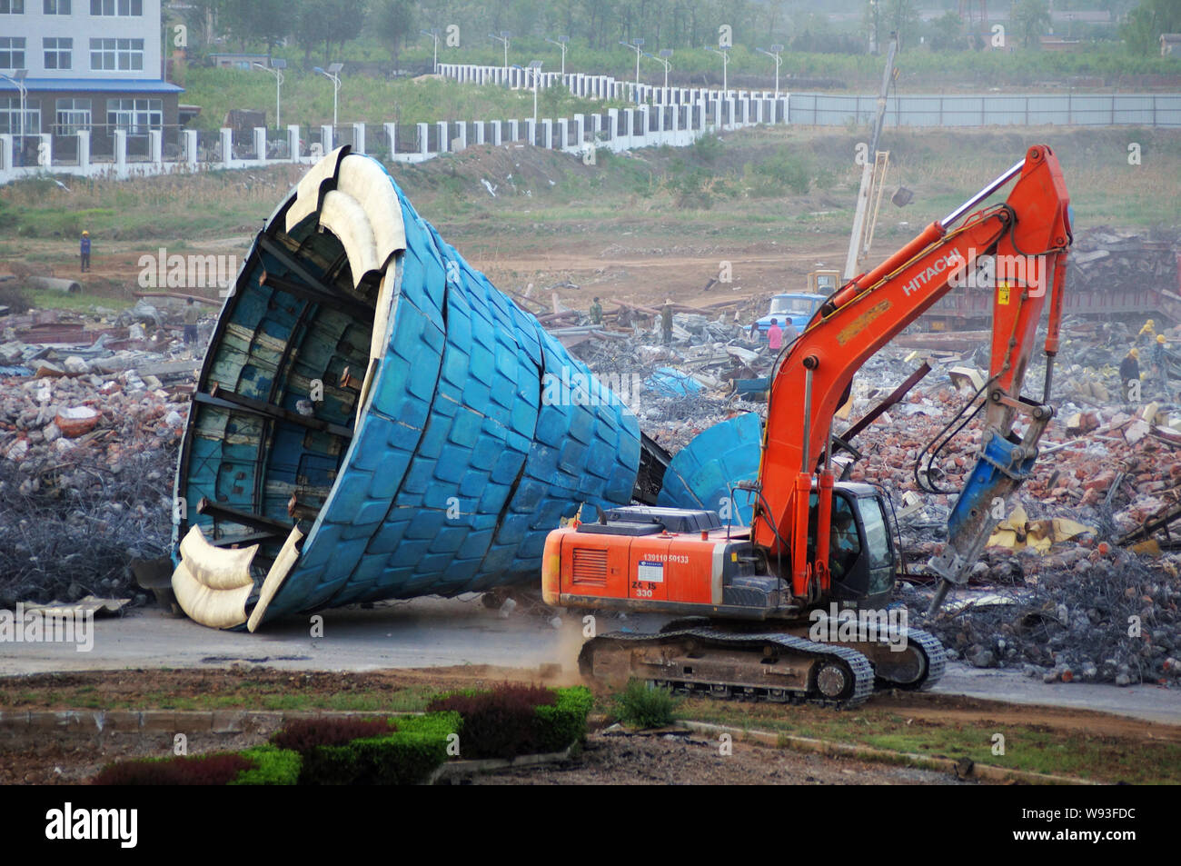 Chinese workers demolish the ruins of some fairytale castles at the ...