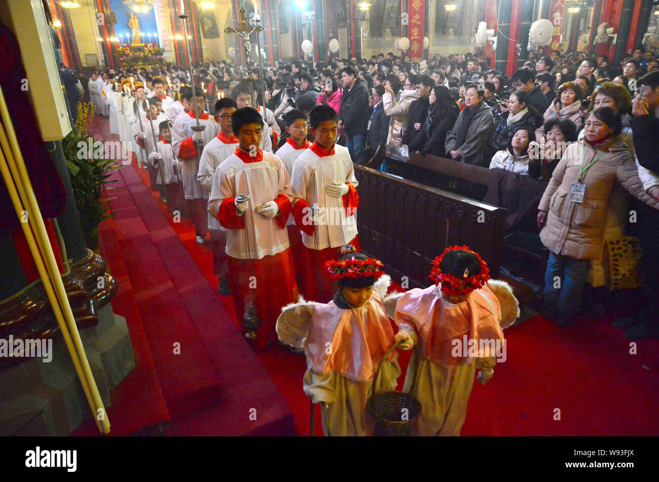 Chinese catholics and servers attend a Christmas Eve Mass Serivce at ...