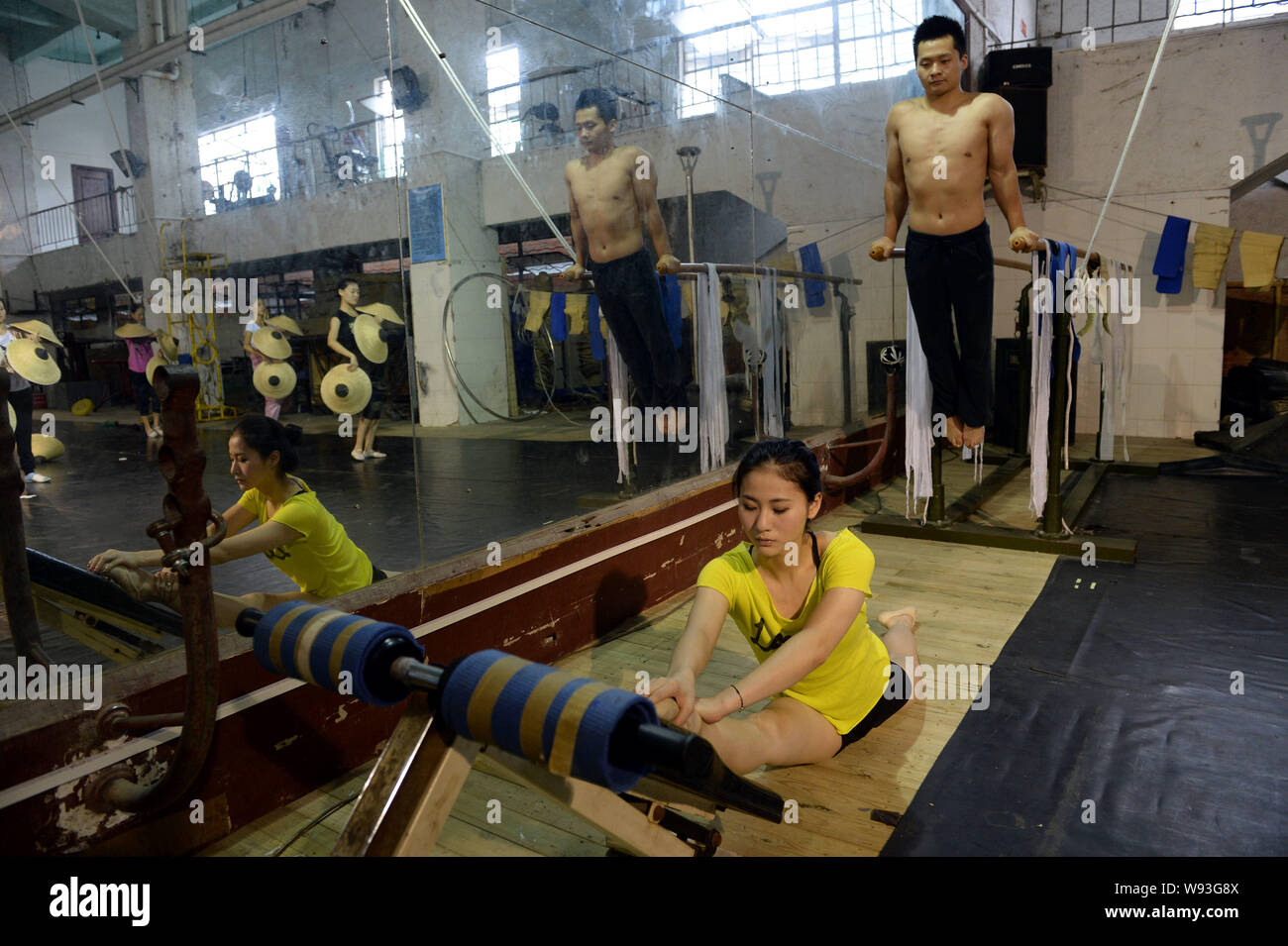 Young Chinese acrobats practice at the training center of the Soldier ...