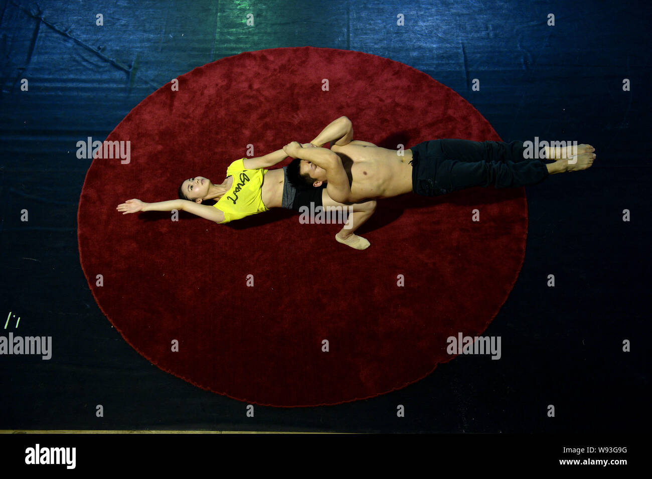 Young Chinese acrobats practice at the training center of the Soldier ...