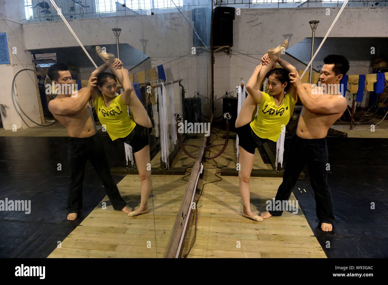 Young Chinese acrobats practice at the training center of the Soldier ...