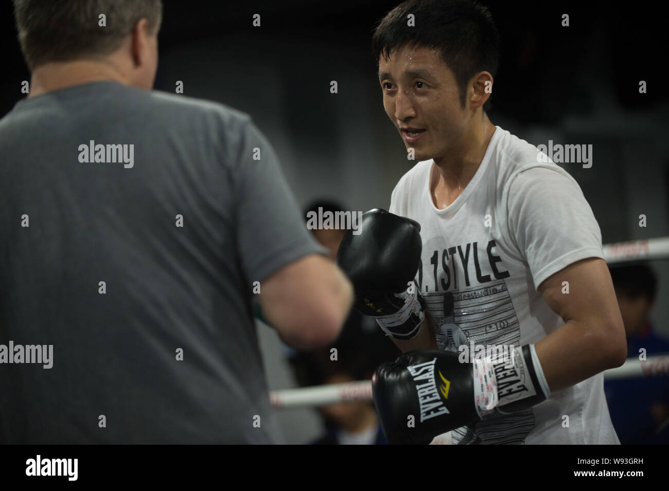 Zou Shiming (right), double Olympic boxing gold medallist, is training ...
