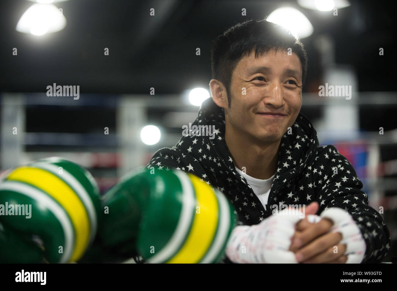Zou Shiming, double Olympic boxing gold medallist, smiles during an ...