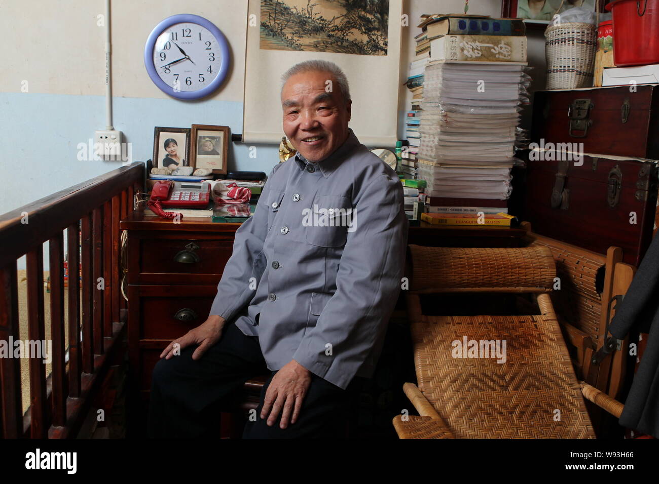 Chinese amateur cartographer Yu Nianchun poses next to his reference ...