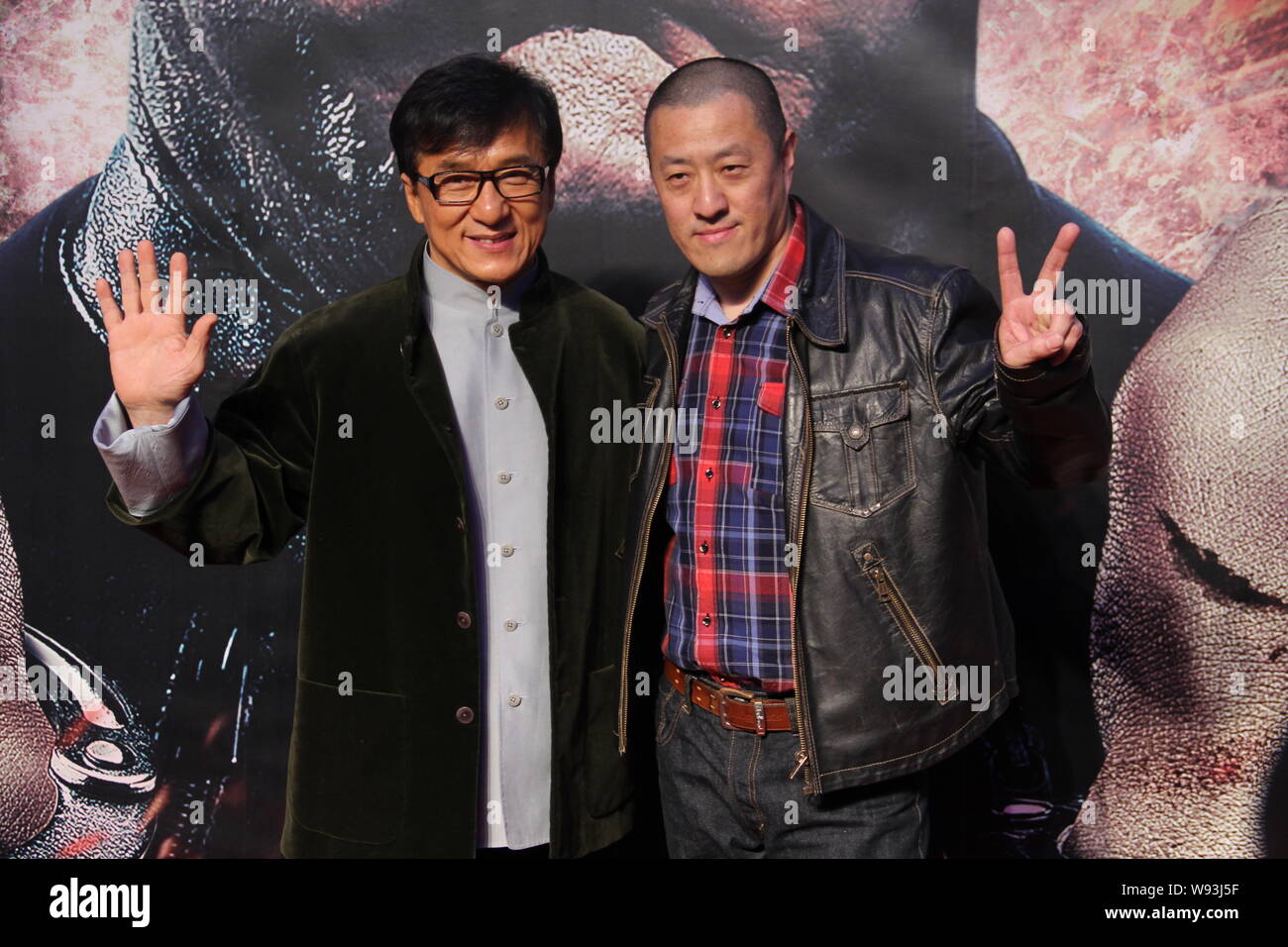 Hong Kong actor Jackie Chan, left, and Chinese director Ding Sheng pose ...