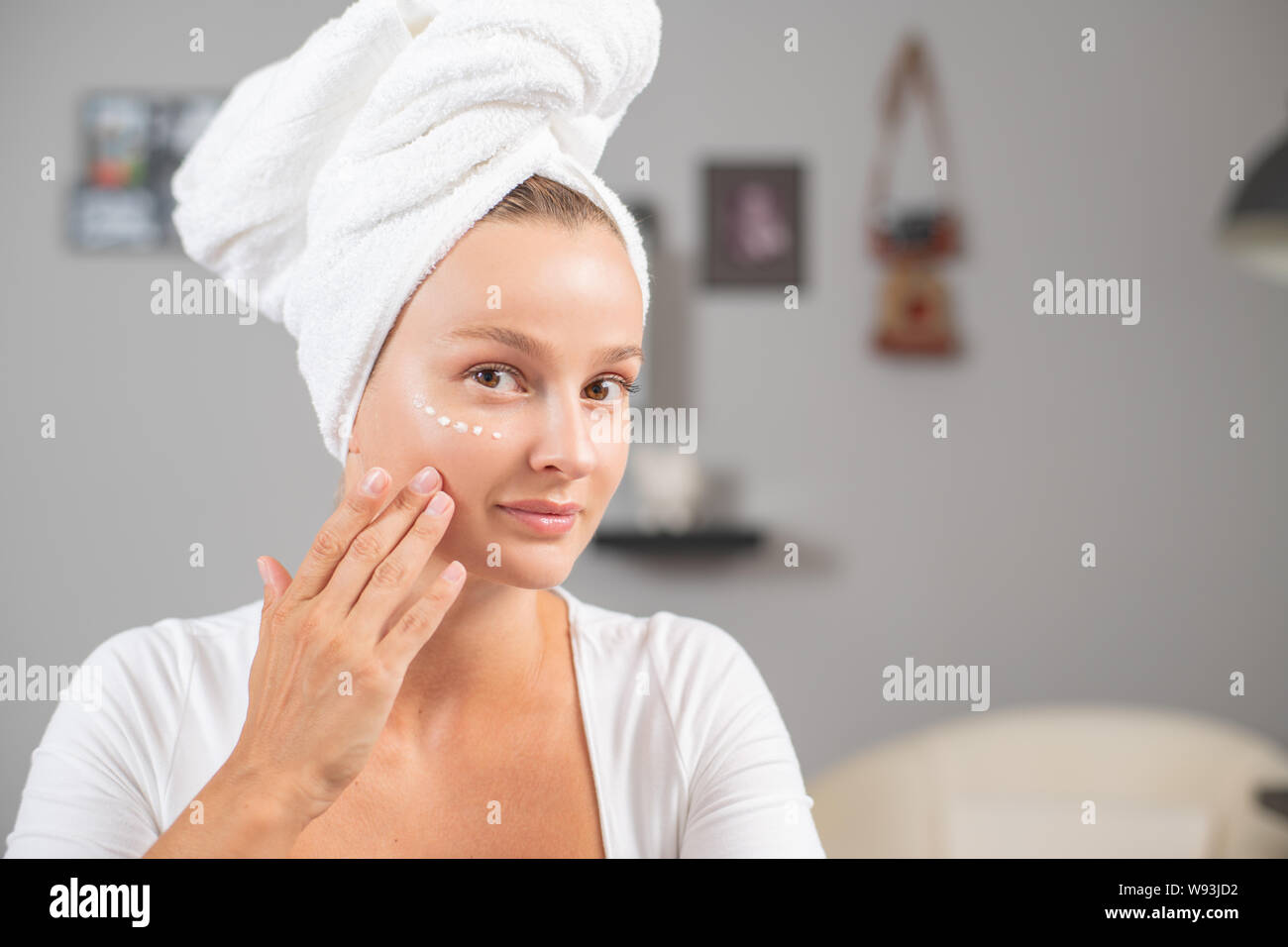 Happy Young Woman Applying Cream To Her Face Cosmetics Woman Face