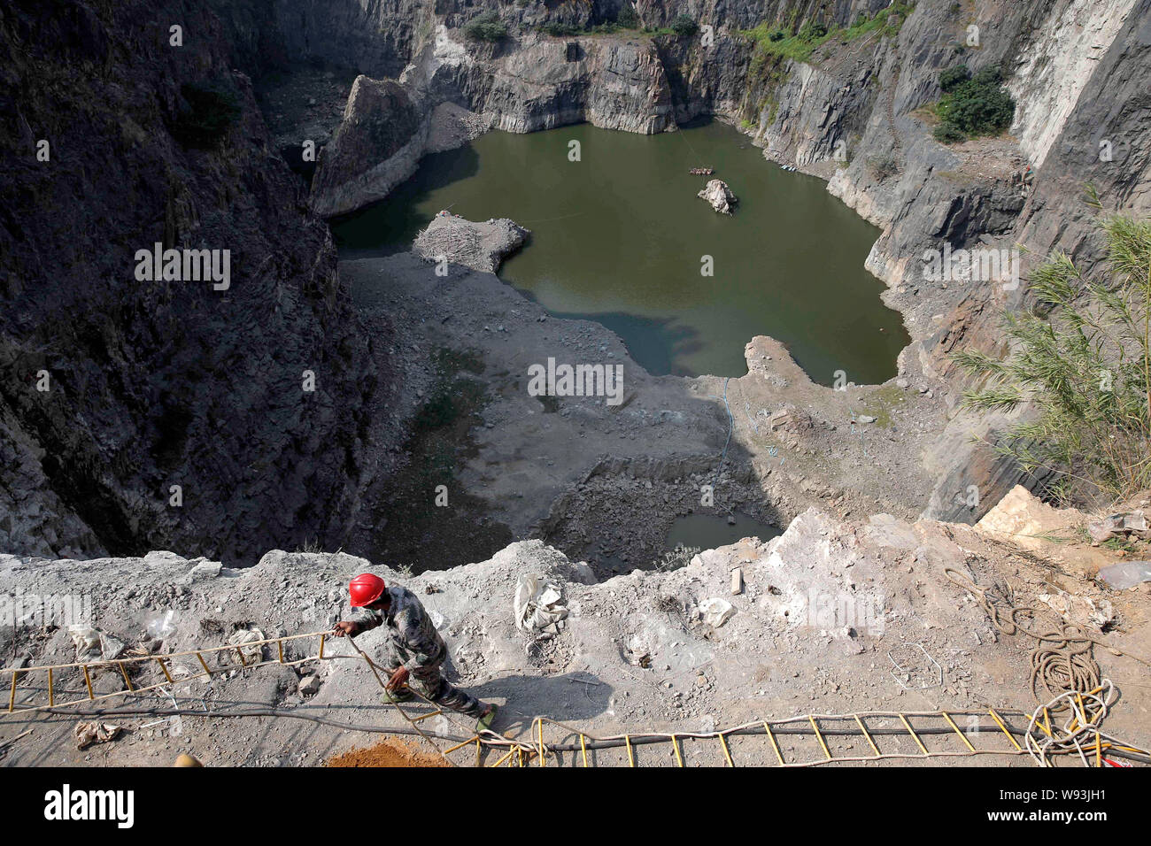 A worker prepares a ladder at the construction site of InterContinental ...