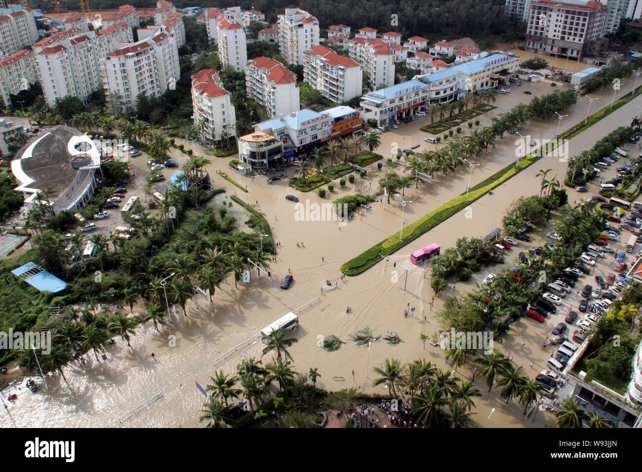 Roads are flooded due to heavy rain caused by Typhoon Haiyan in Sanya ...