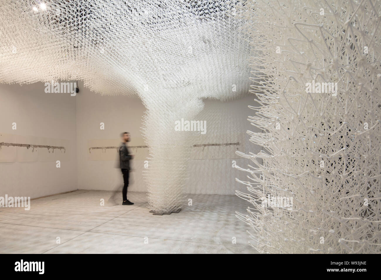 3D structure - lit from above and glowing with figure. Cloud Pergola at Venice Biennale 2018 ...