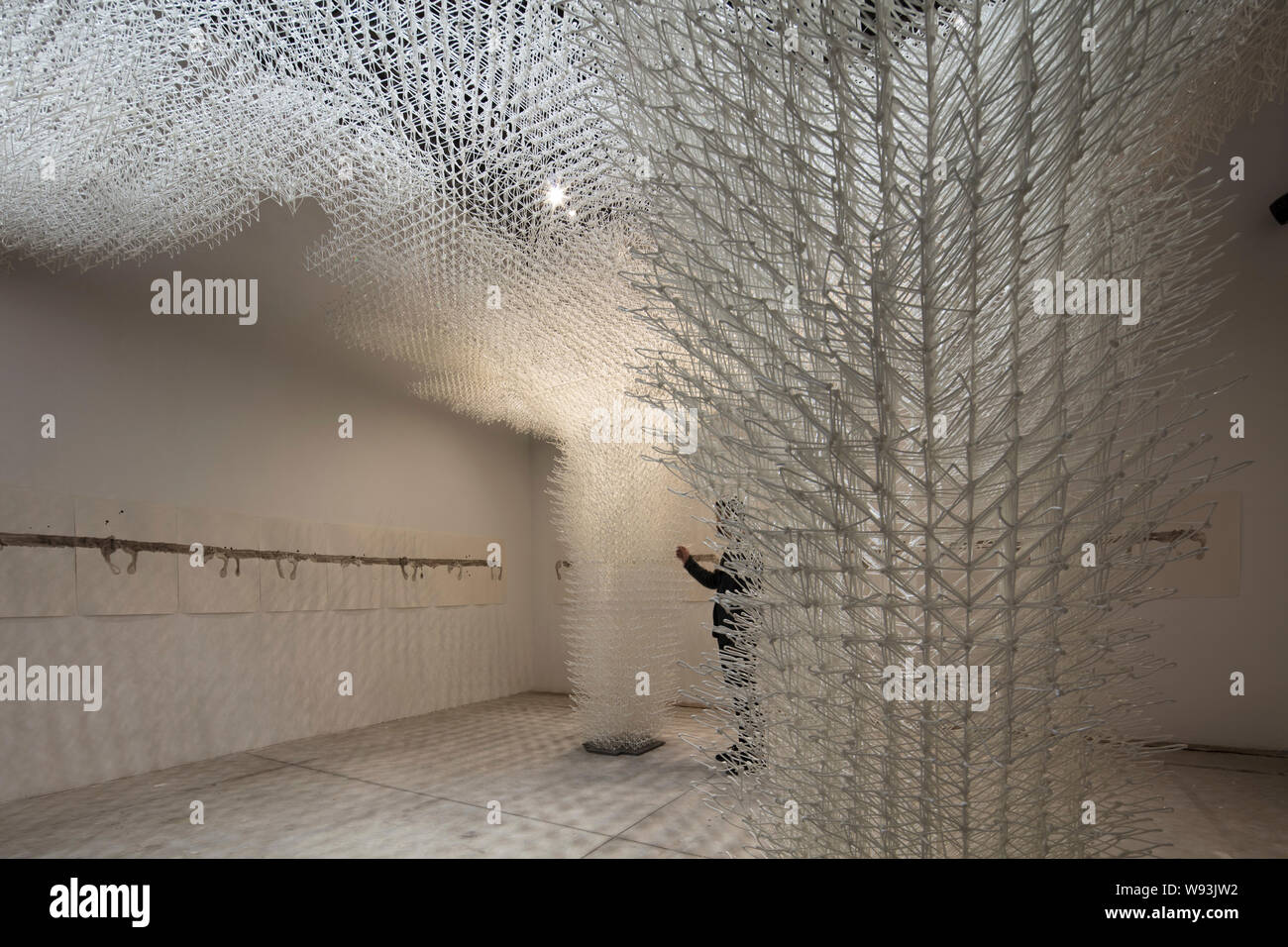 3D structure - lit from above and glowing with figure. Cloud Pergola at Venice Biennale 2018 ...