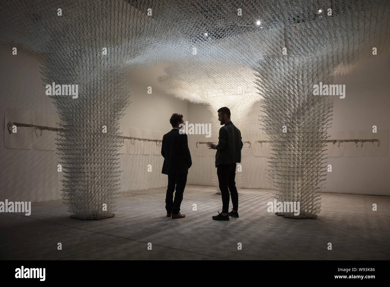 3D structure - lit from above and glowing with figure. Cloud Pergola at Venice Biennale 2018 ...