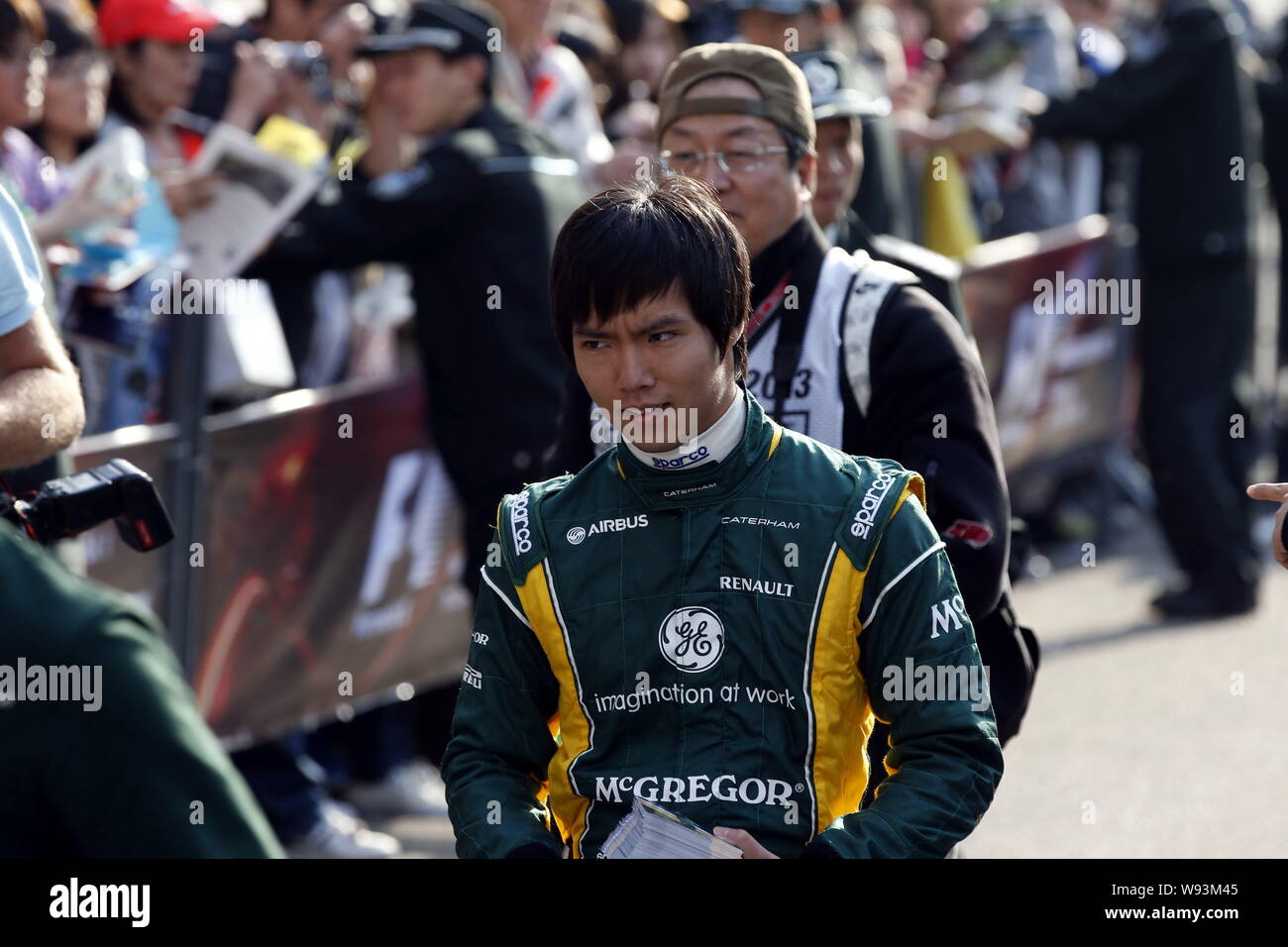 Chinese driver Ma Qinghua of Caterham arrives to meet fans at the ...