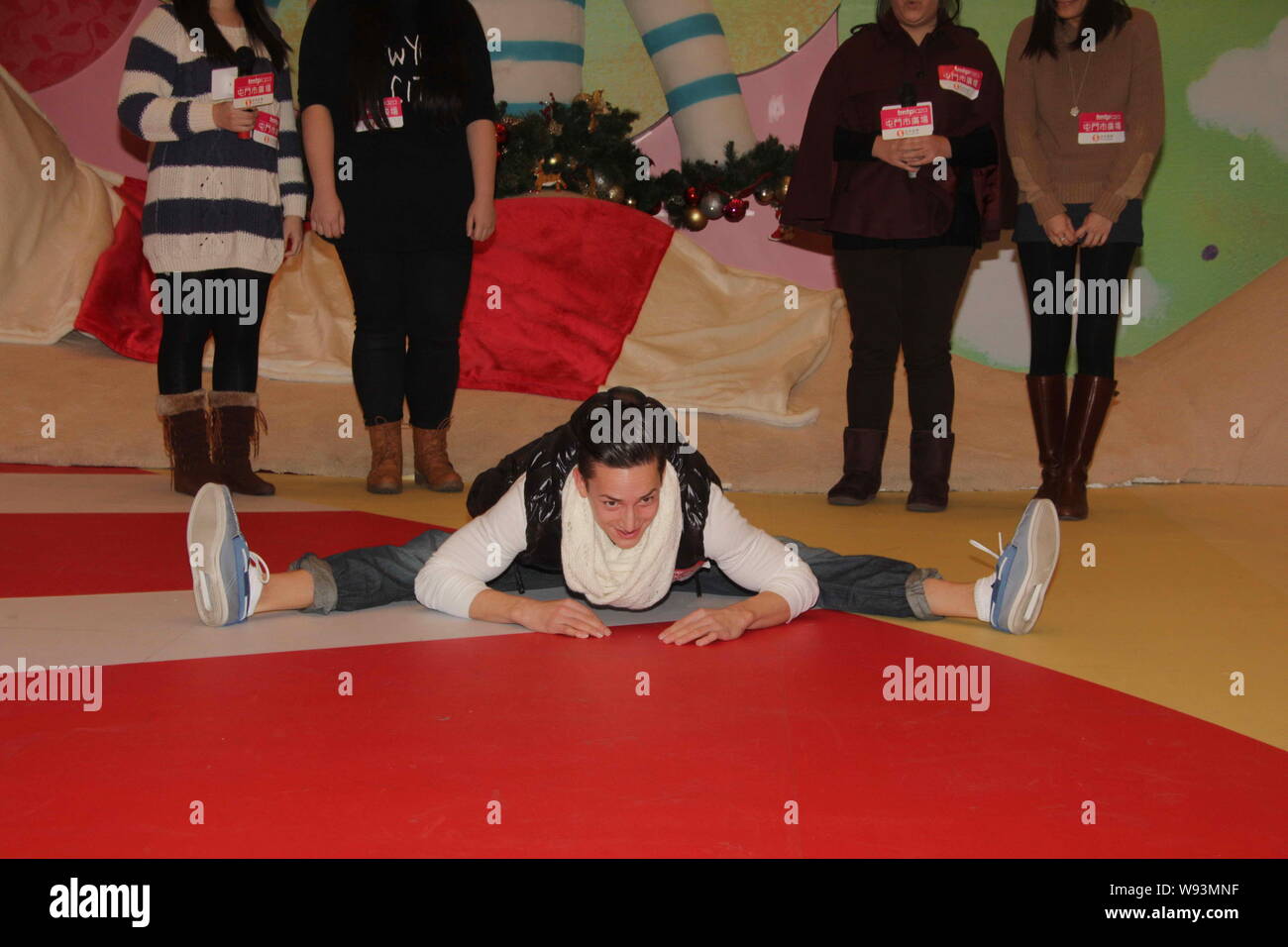 German gymnastics star Marcel Nguyen stretches his legs during a fans ...
