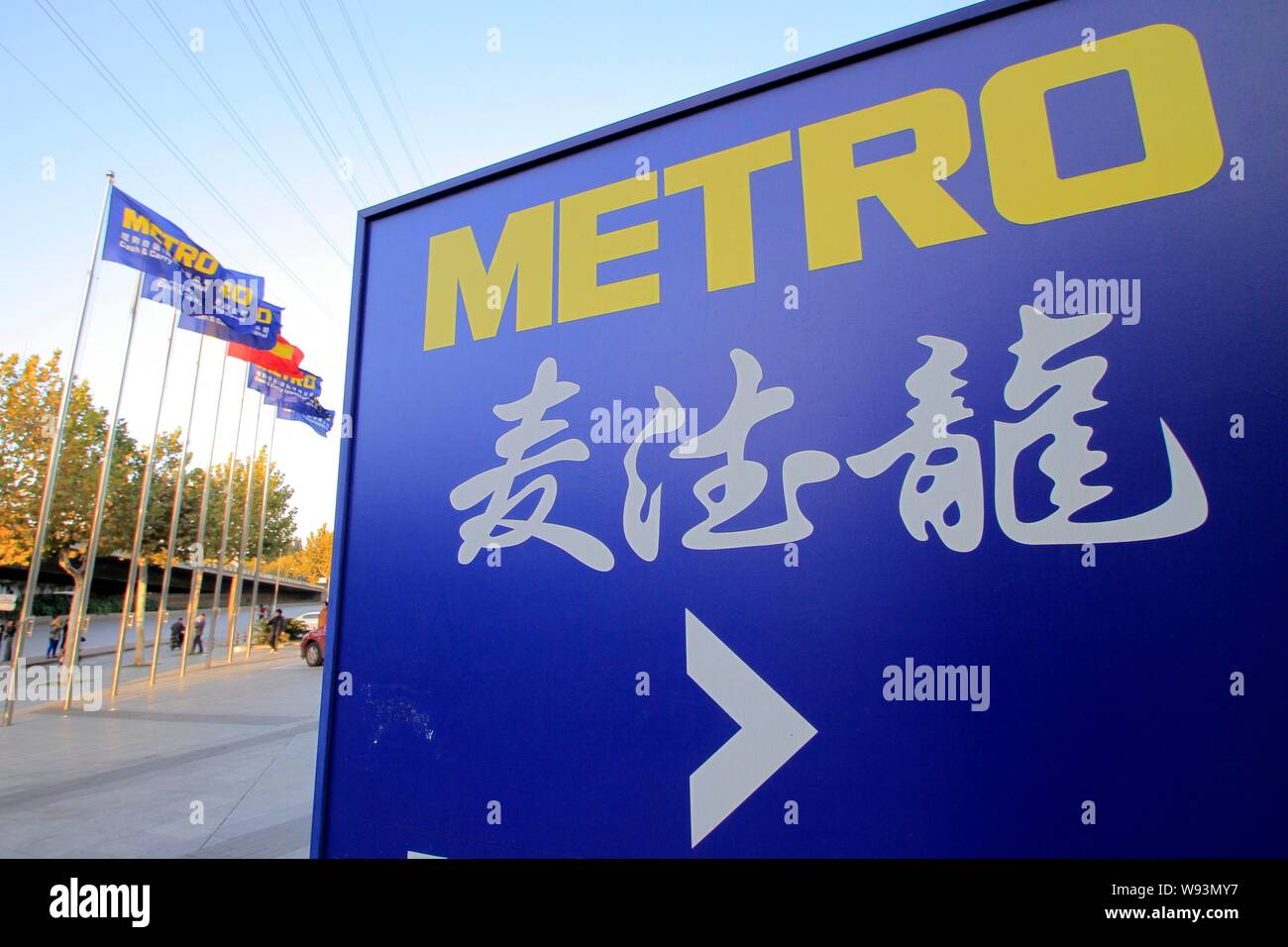 --FILE--A sign board of the chain supermarket, Metro Group is seen in ...