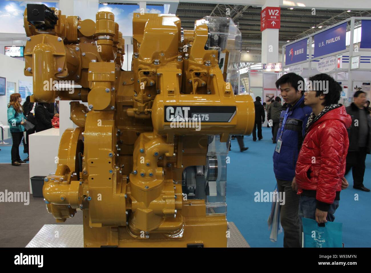 --FILE--Visitors look at a Caterpillar (CAT) C175 diesel engine during ...