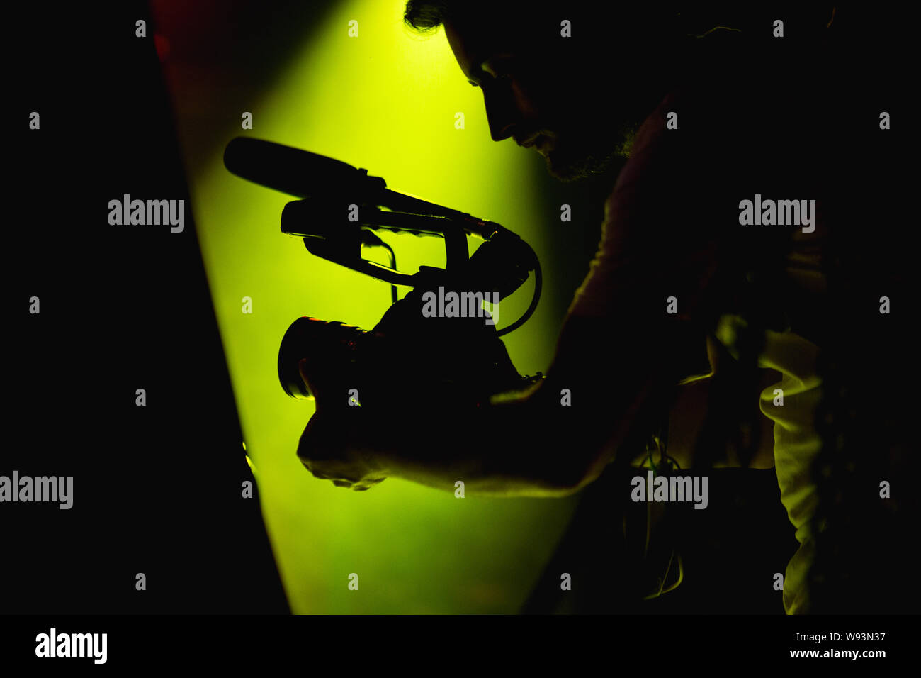 Professional video camera operator working his equipment video hi-res ...