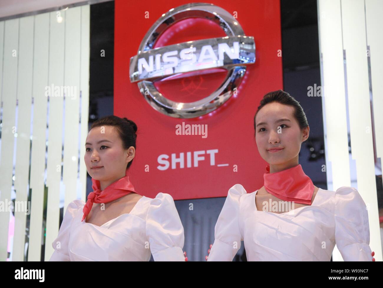--FILE--Models pose at the stand of Nissan during an auto show in ...