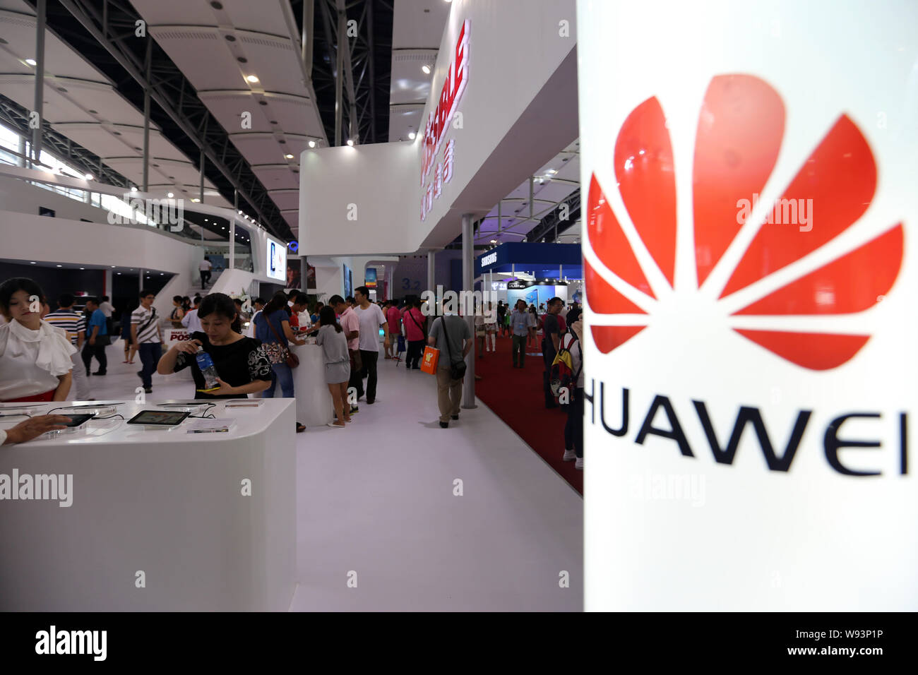 --FILE--People visit the stand of Huawei during the 2013 Tianyi (E ...