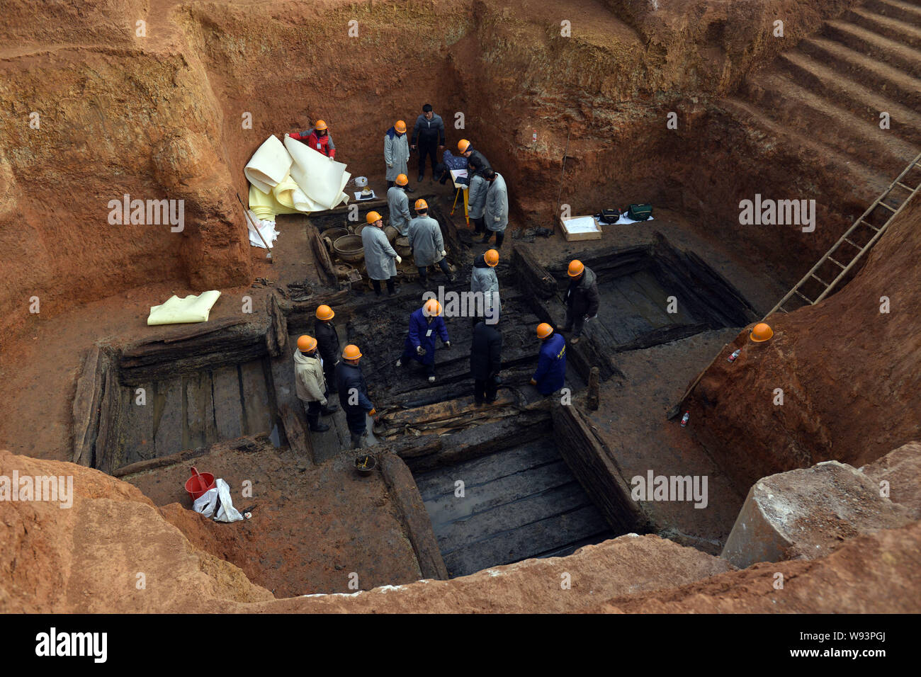 Chinese archaeologists prepare to remove wooden roof beams that covered ...