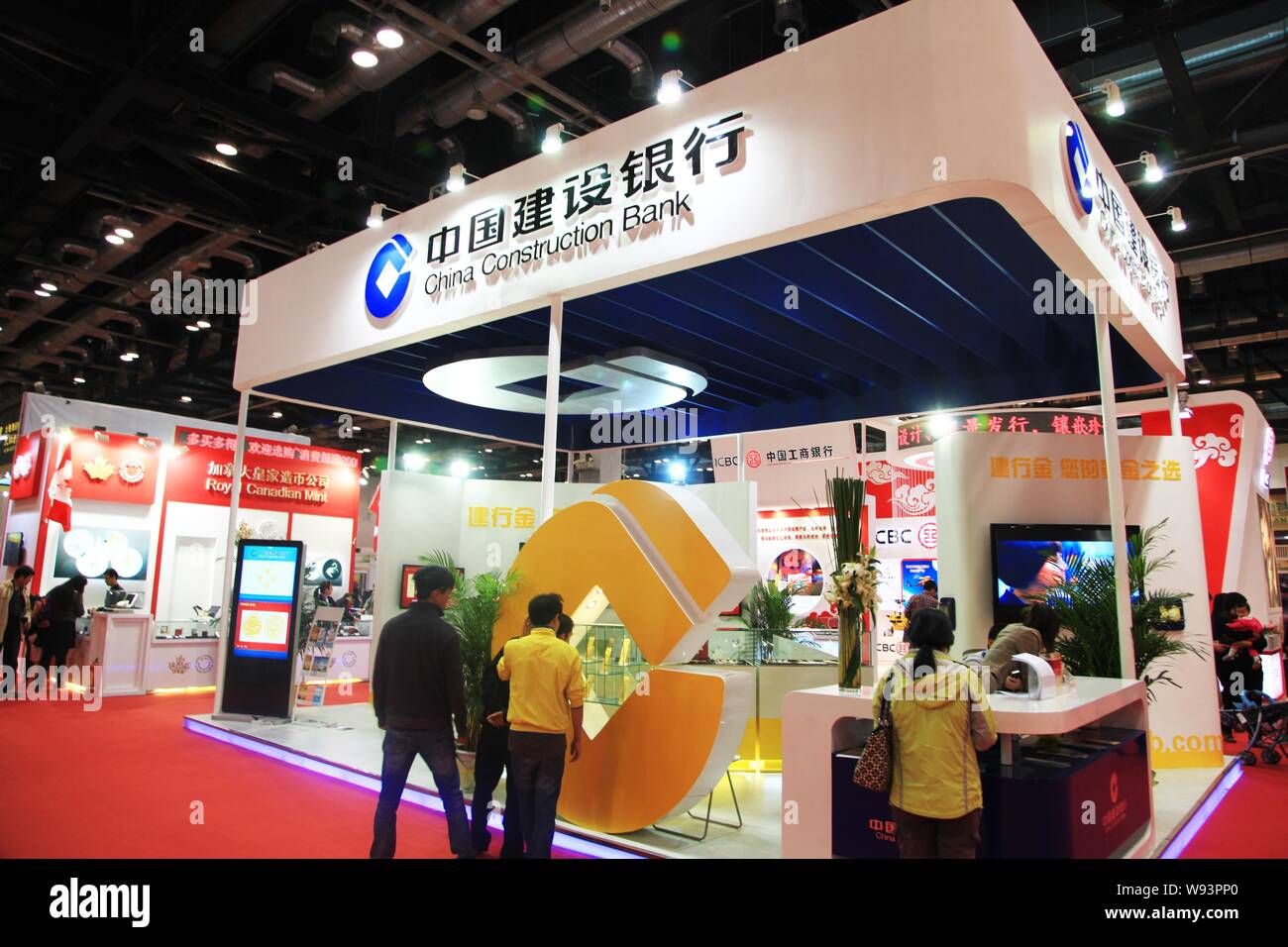 --FILE--People visit the stand of China Construction Bank (CCB) during ...