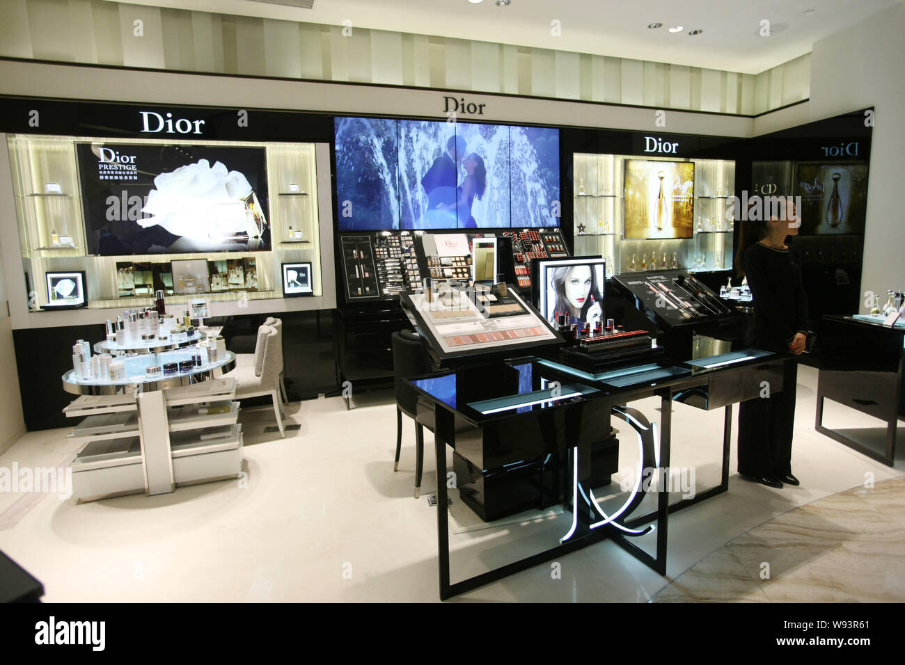 An employee is seen at a cosmetics store of Dior in the newly-opened ...