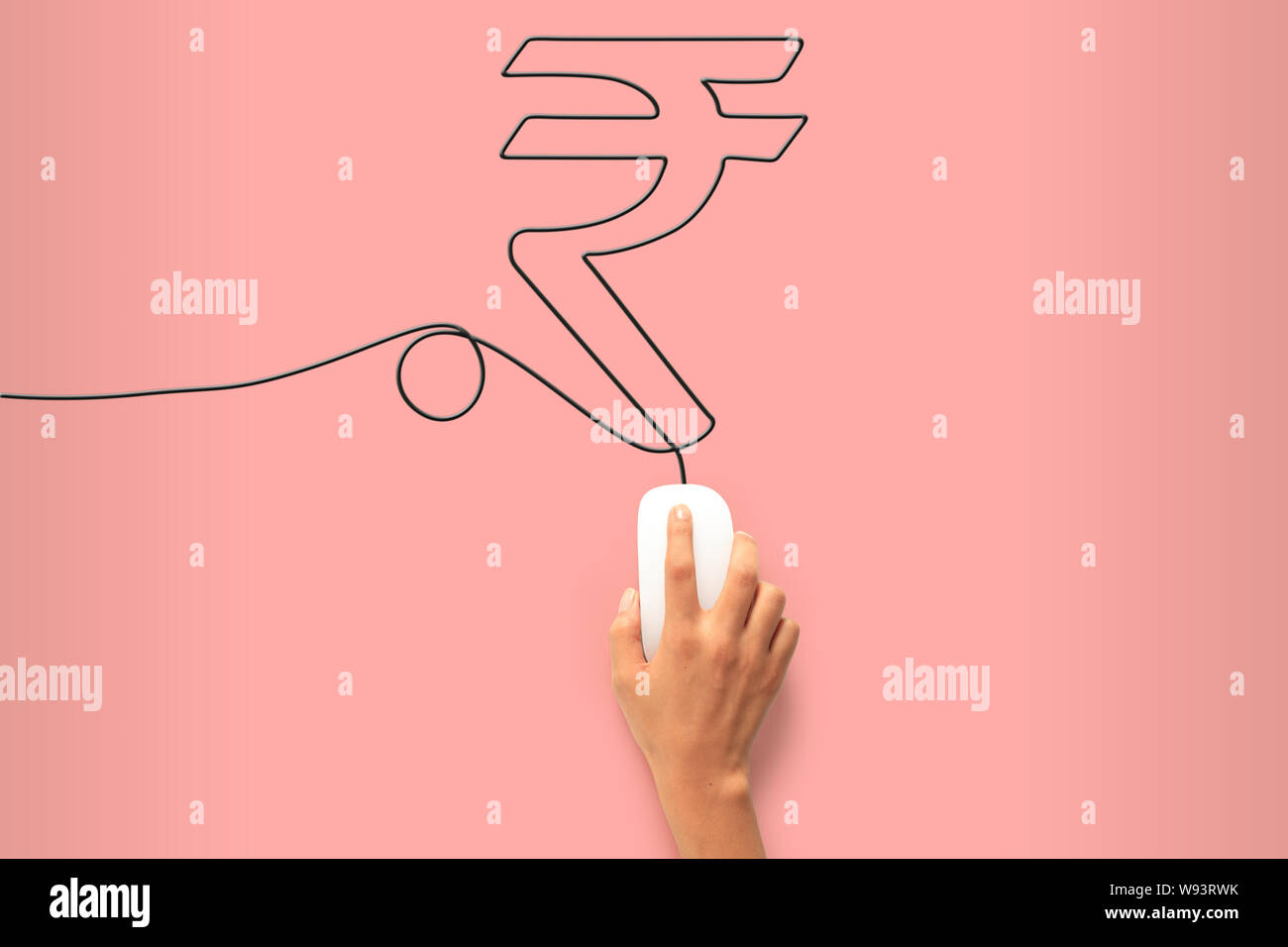 Human hand controlling a computer mouse and its wire making Rupee ...