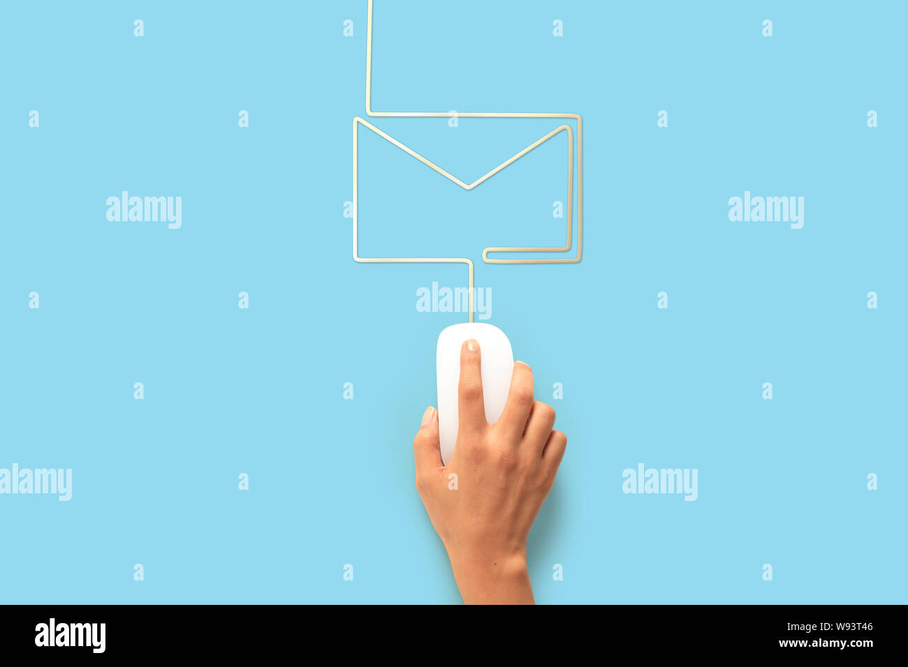 Computer mouse with its wire making a mail icon Stock Photo - Alamy