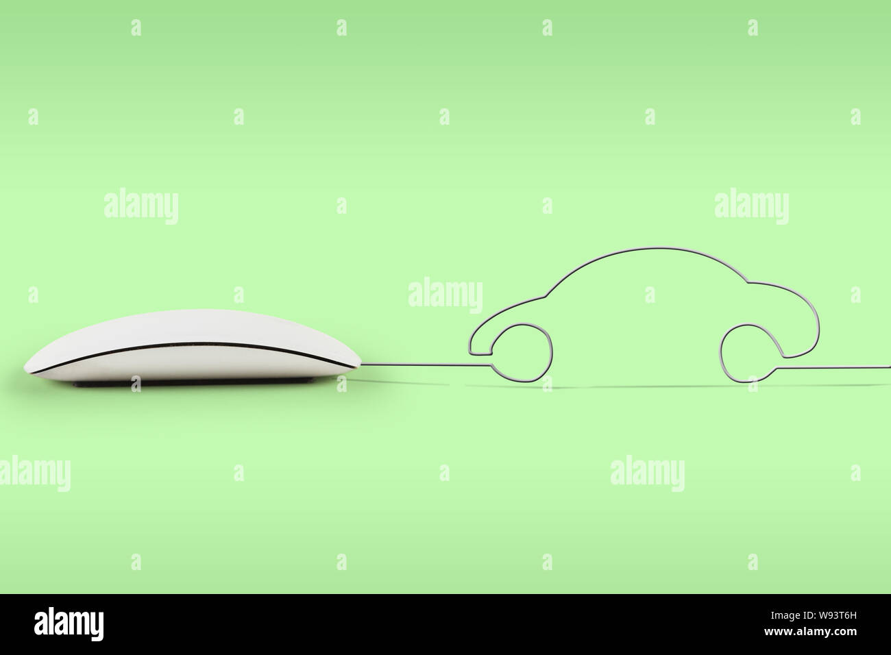 Computer mouse with its wire making a car Stock Photo - Alamy