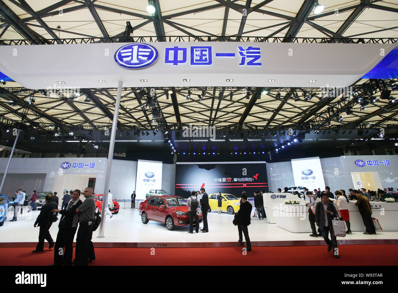 --FILE--People visit the stand of FAW (First Automobile Works)during ...