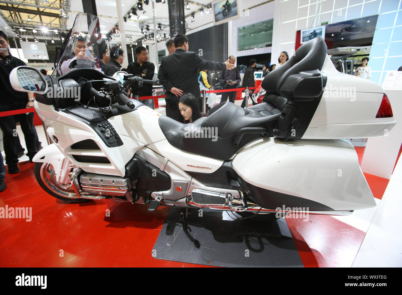 Visitors look at a Gold Wing (or Goldwing) motorcycle of Honda during ...