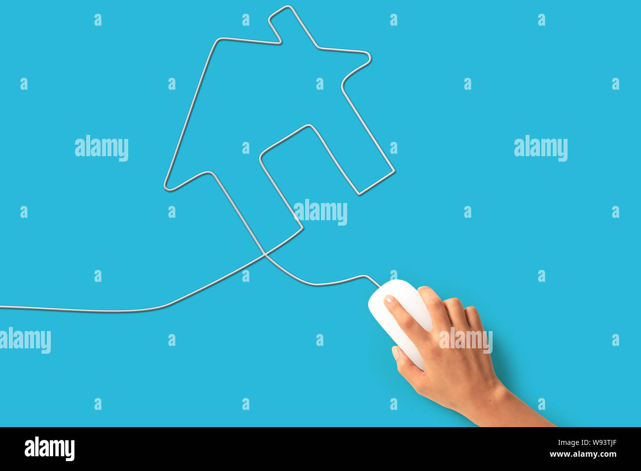 Computer mouse with its wire making a model home Stock Photo - Alamy