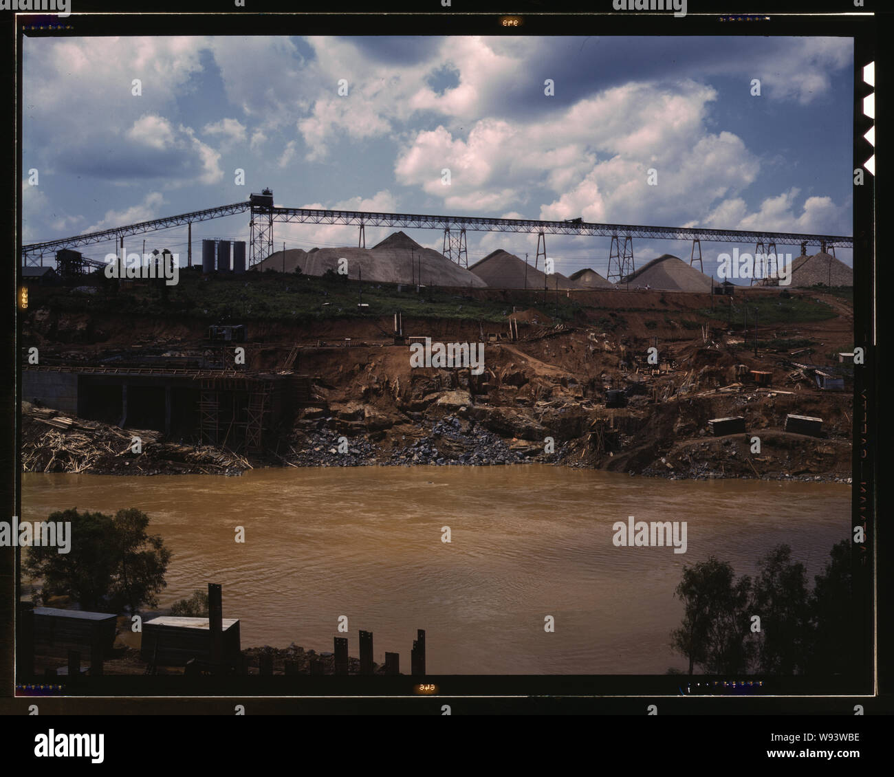 Above the construction work, the aggregate storage pile which provides ...