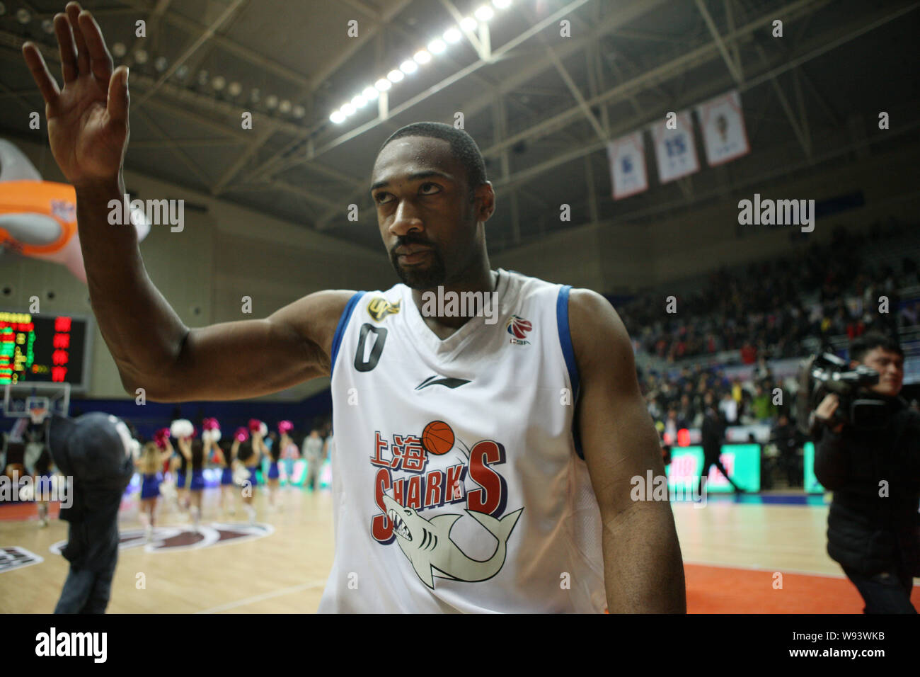 Gilbert Arenas of the Shanghai Sharks waves to the spectators after he ...