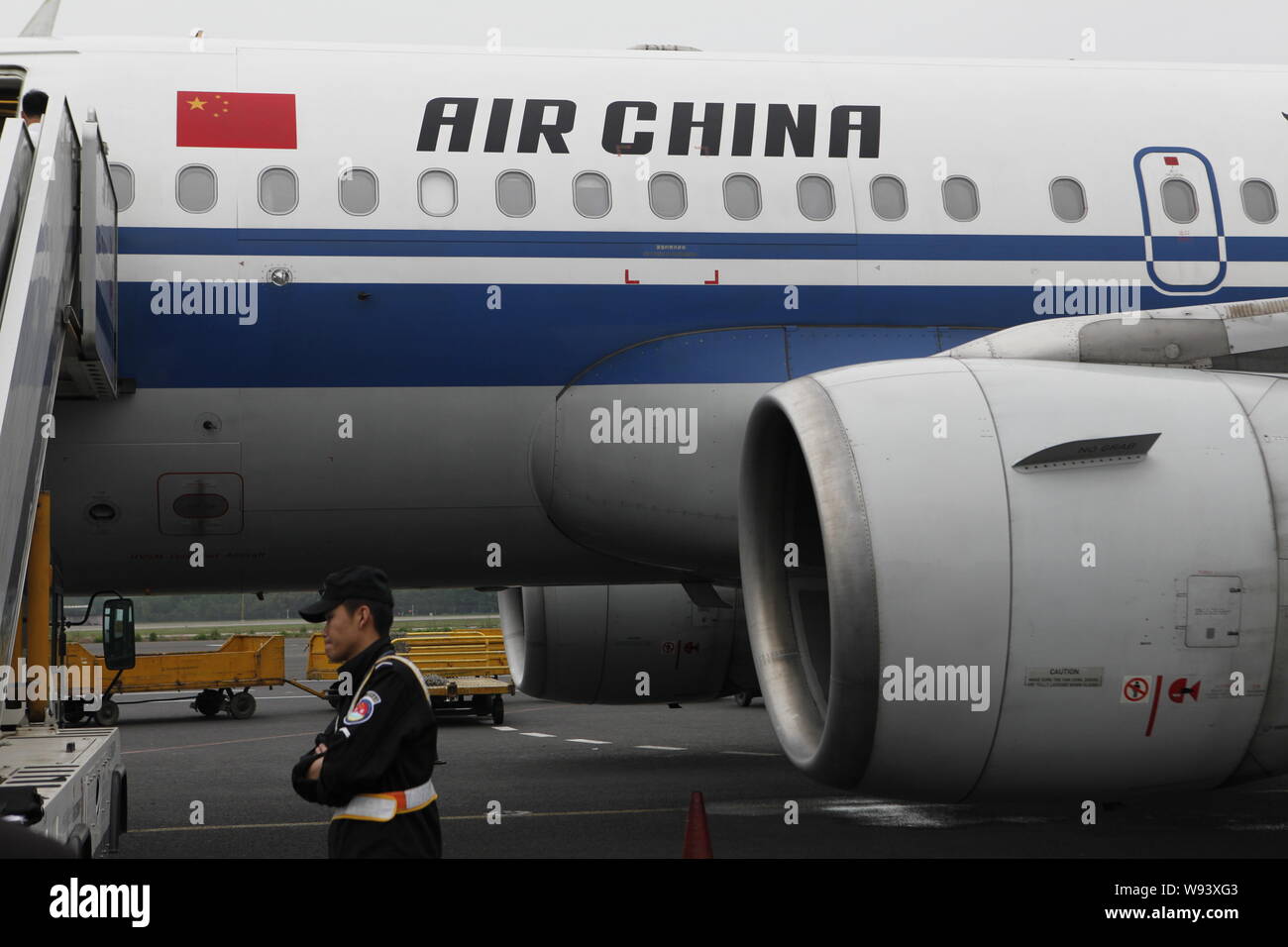 --FILE--A Chinese ground crew member walks past an Airbus jet plane of ...