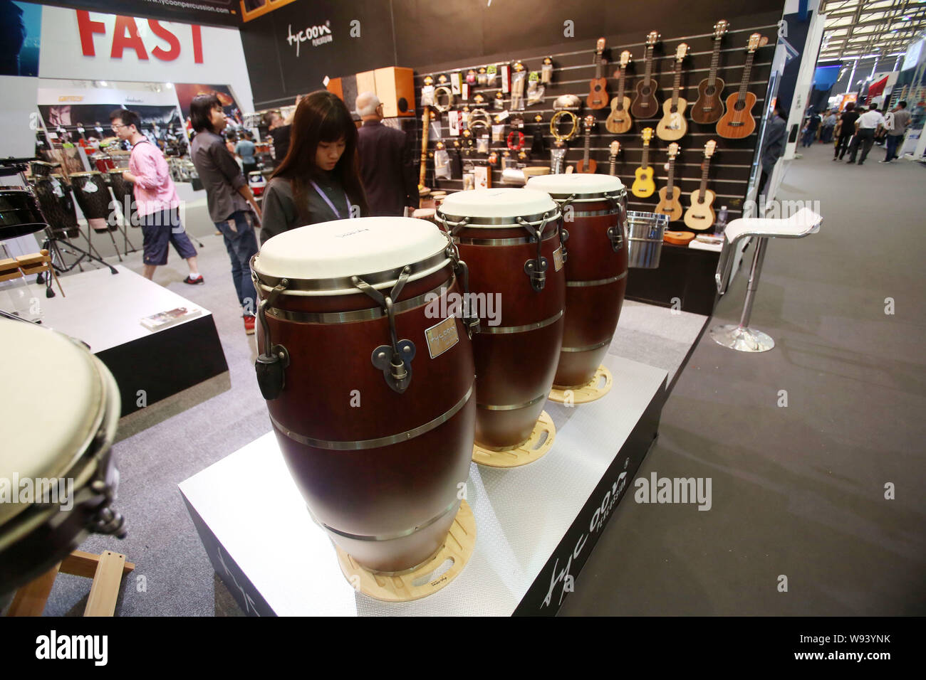 Visitors view drums and other musical instruments during the China ...