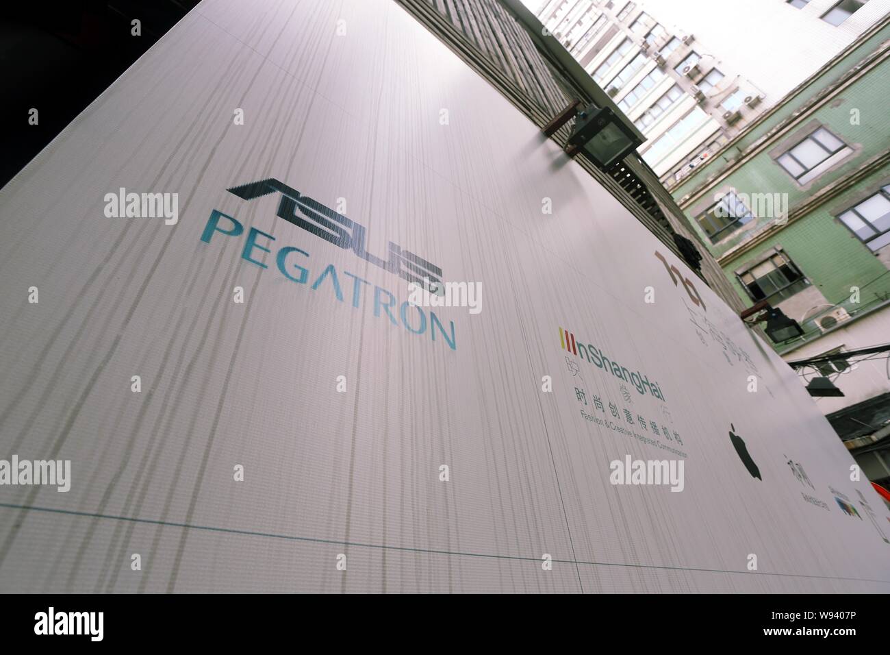 The logos of Asus and Pegatron Corporation are seen on a signboard next ...
