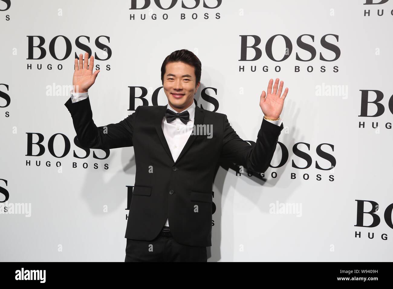 South Korean actor Kwone Sang Woo waves as he arrives for a fashion ...