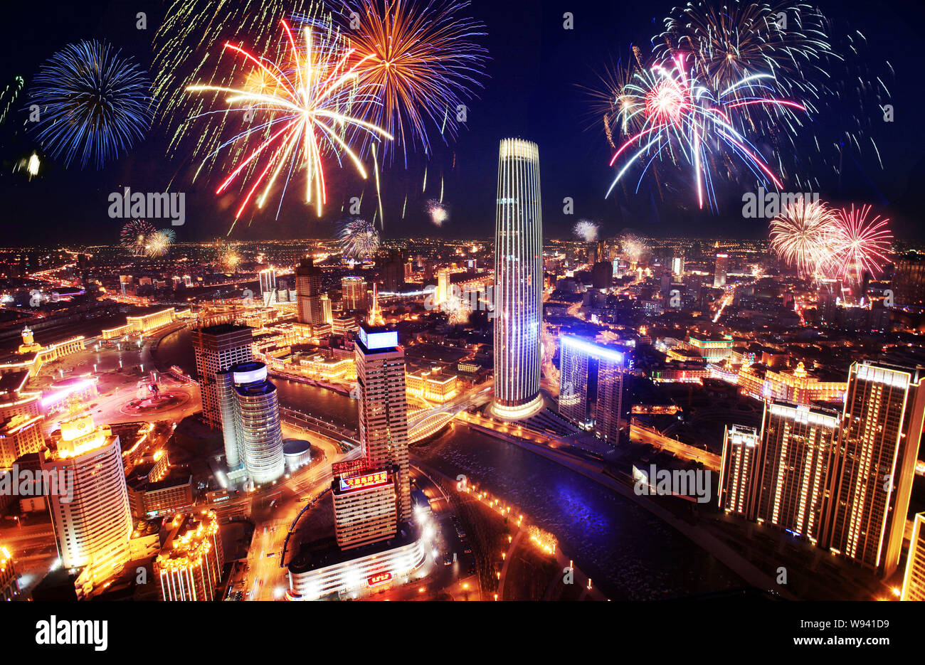 --FILE--Fireworks explode over the Tianjin World Financial Center ...