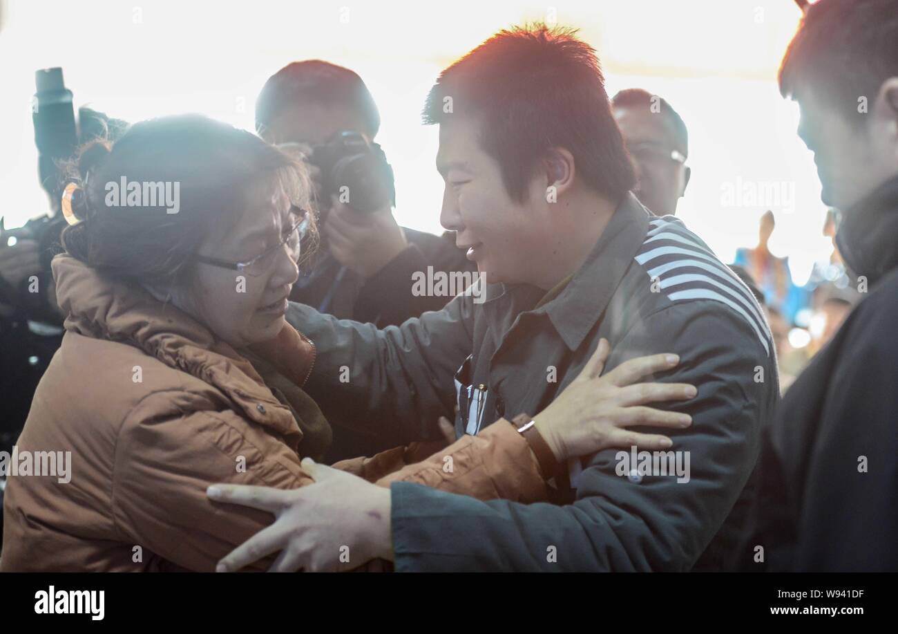 --FILE--A Chinese inmate, second right, cries as he meets his mother at ...