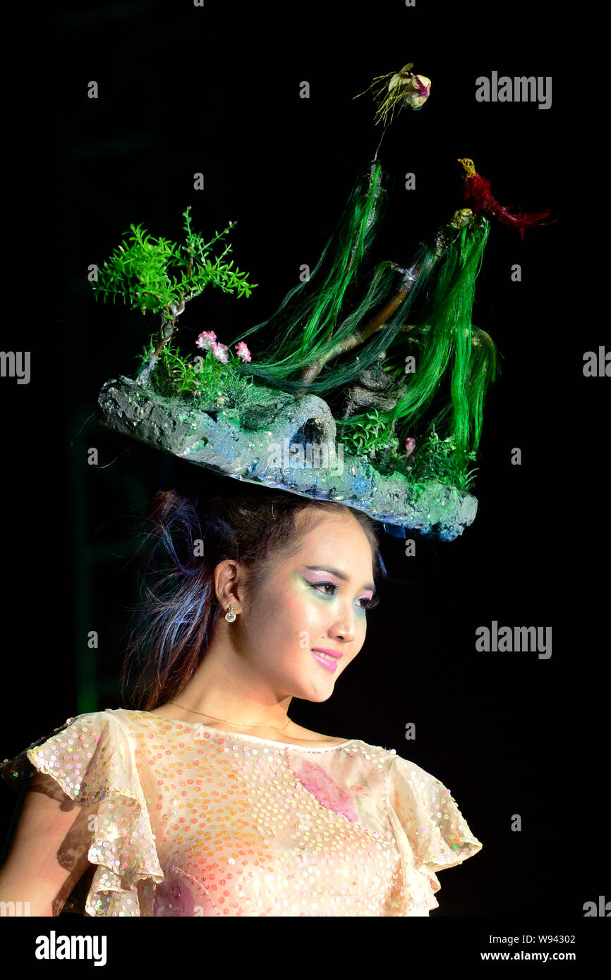 A Chinese model displays a new hairstyle creation showing Spring Dawn ...