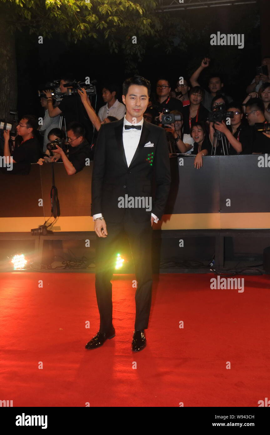 South Korean actor Zo In-sung poses on the red carpet as he arrives for ...