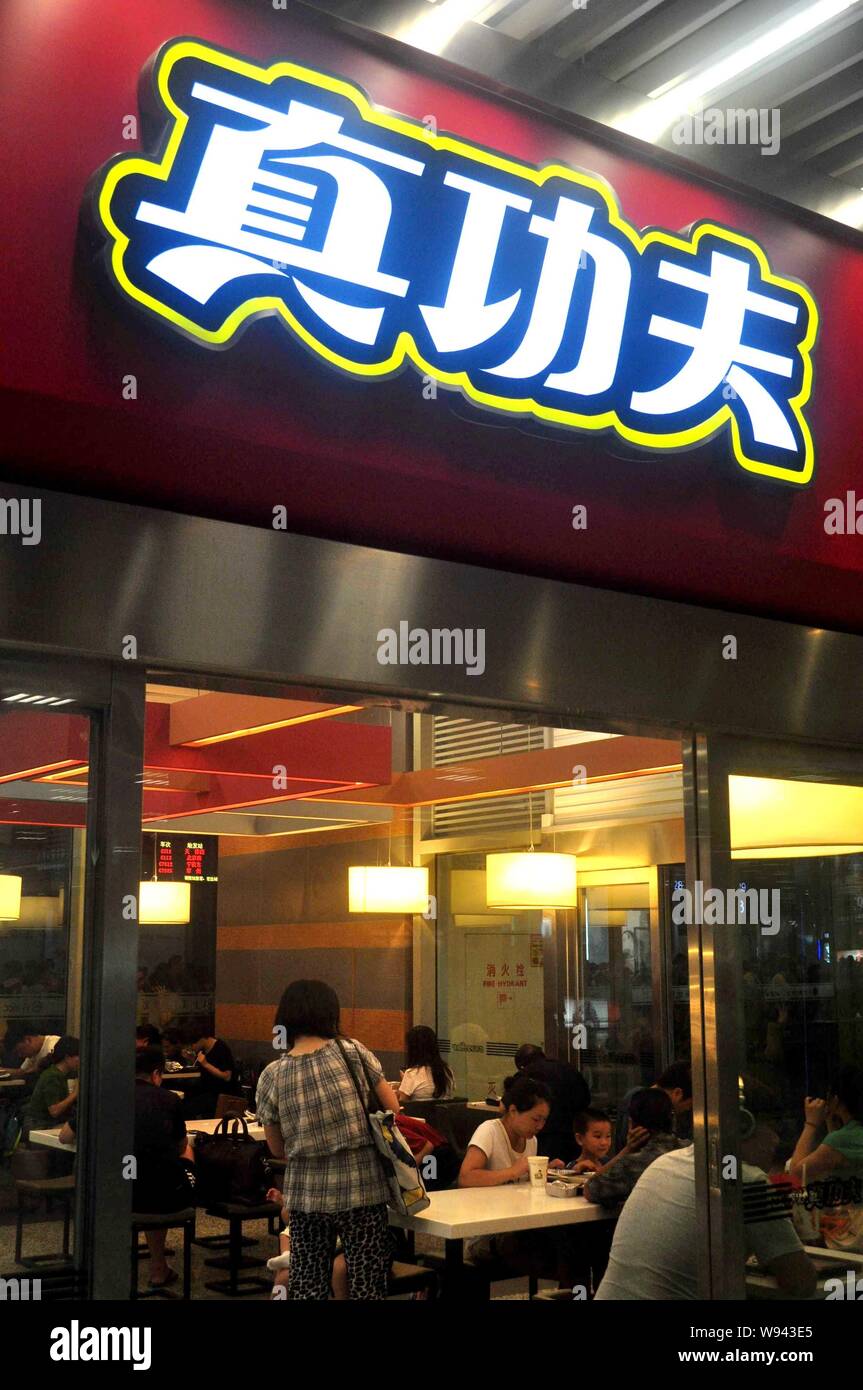 Customers eat at a Kungfu fast-food restaurant in Shanghai, China, 20 ...