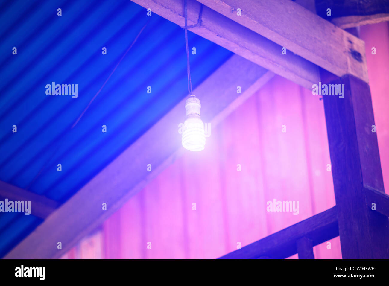 Light bulbs hanging in front of the house Stock Photo - Alamy