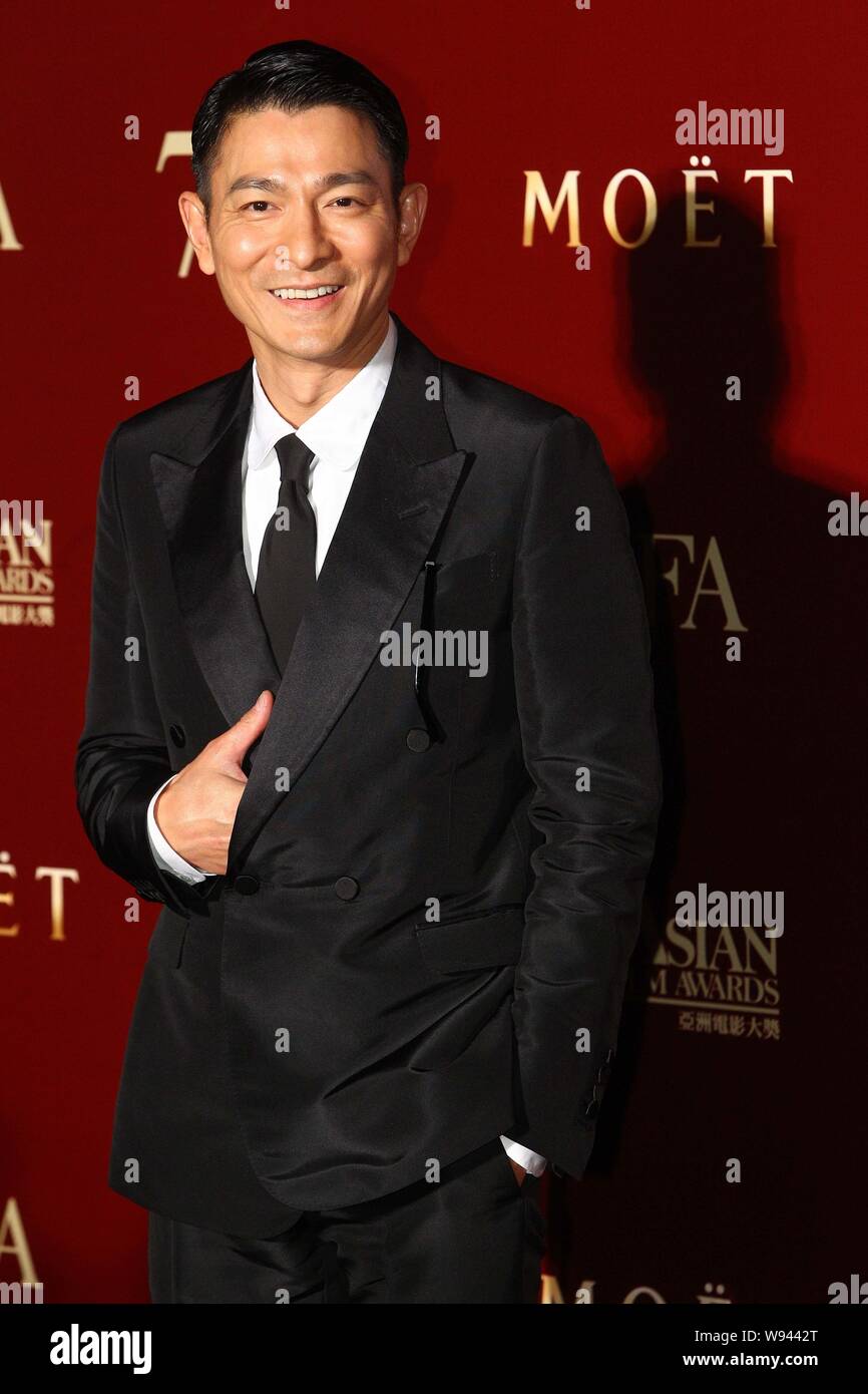 Hong Kong singer and actor Andy Lau poses on the red carpet as he ...